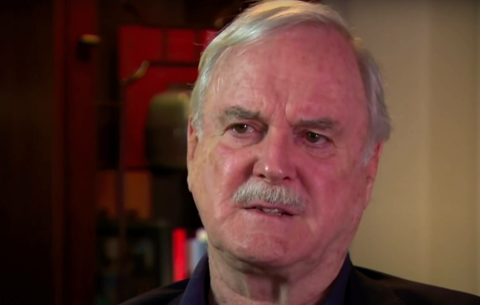 John Cleese responds to slavery joke backlash after mic was "confiscated"