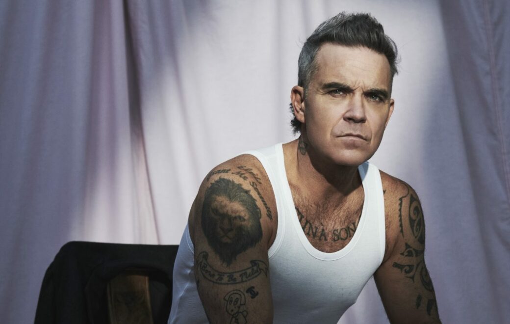 Robbie Williams previews new album with anthemic single ‘Spies’
